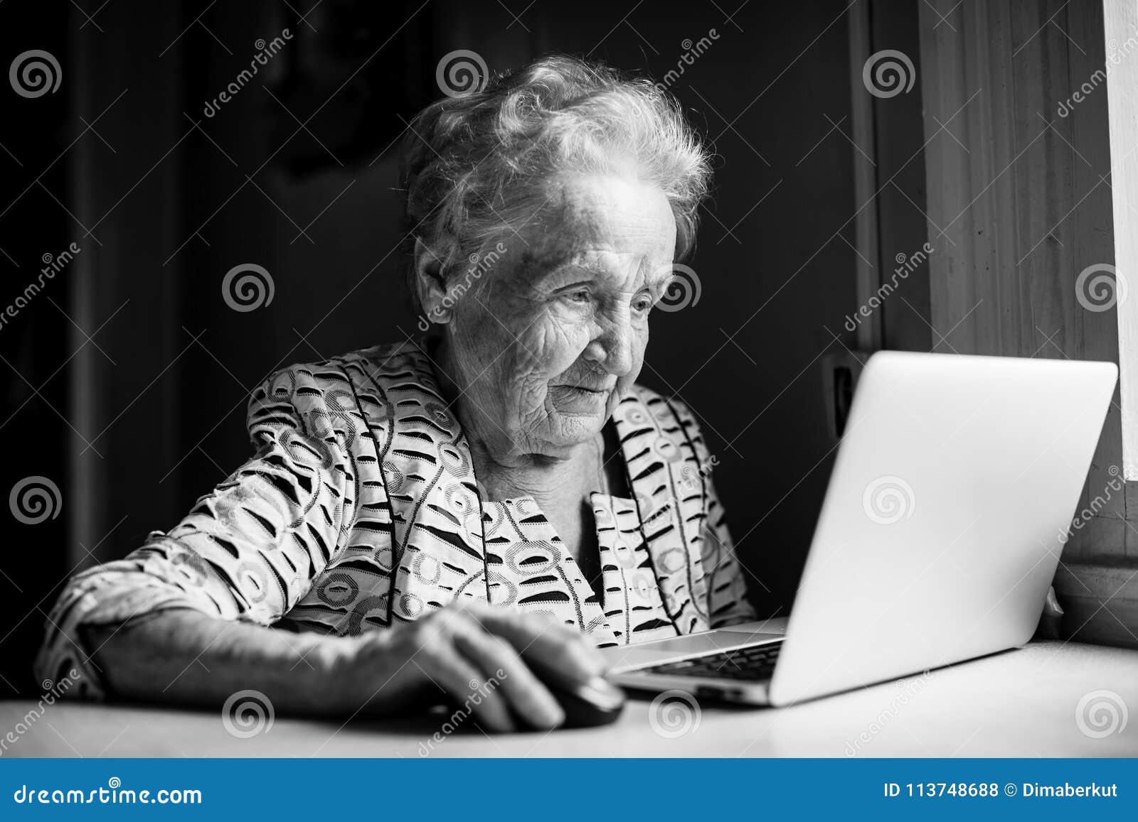 Elderly Woman Works on a Laptop. Working. Stock Photo - Image of ...