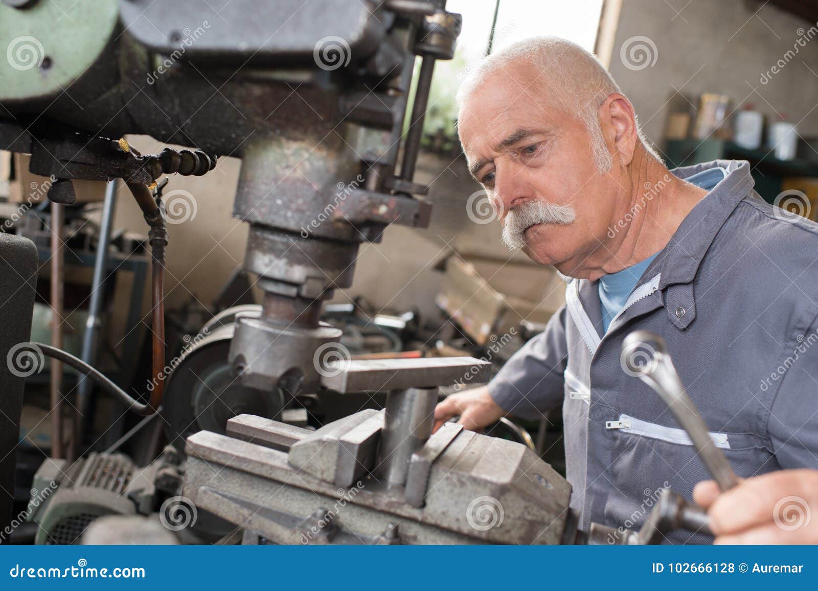 Elderly Worker Watches Processing Detail On Milling Machine Royalty ...