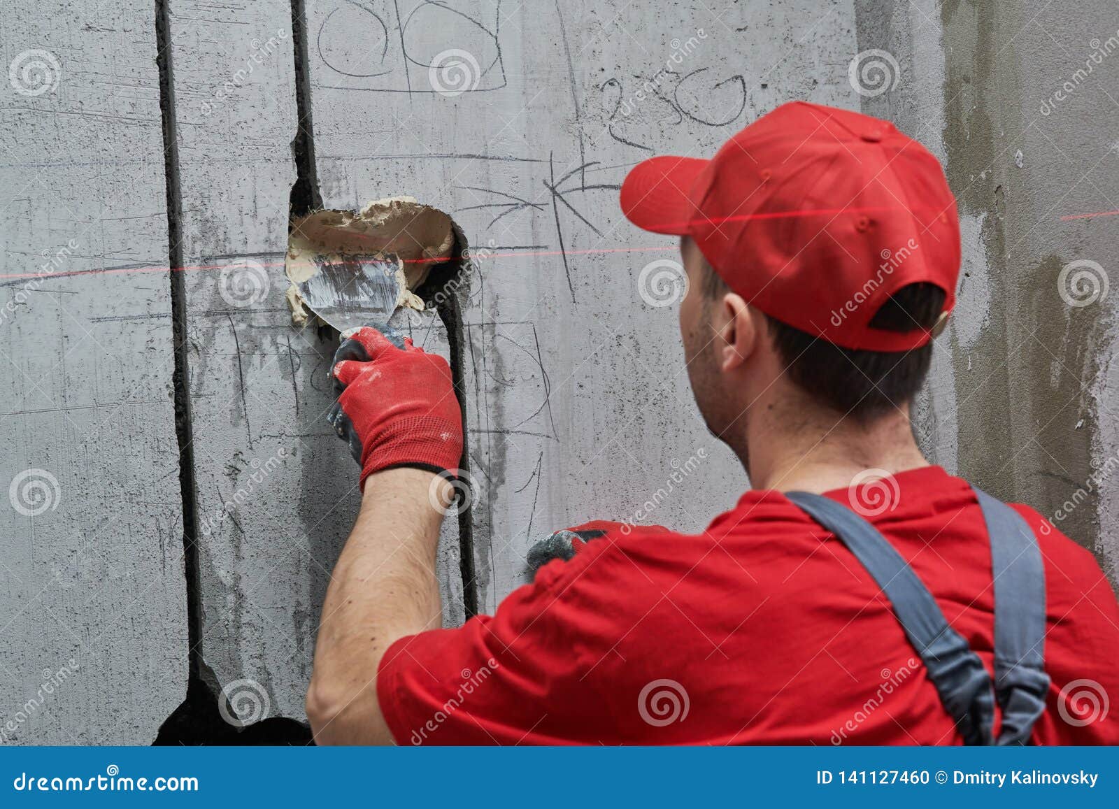 Elecrician Work. Installing Wall Electric Outlet with Laser Level Stock ...