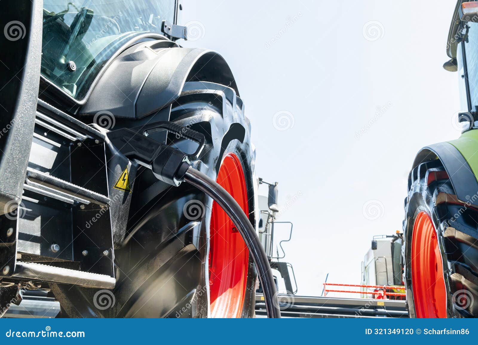 Electric Agricultural Tractor with Connected Charging Cable. Concept ...