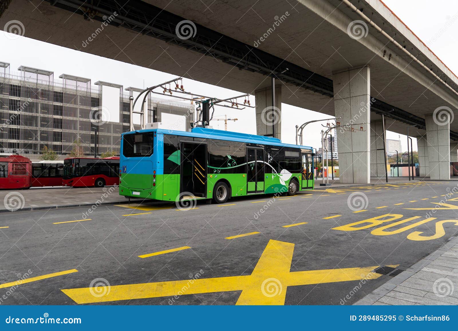 Electric Bus at a Stop is Charged by Pantograph. Clean Mobility Stock ...