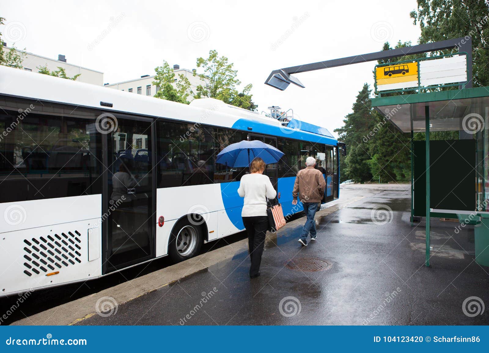 Electric bus at a stop editorial image. Image of street - 104123420