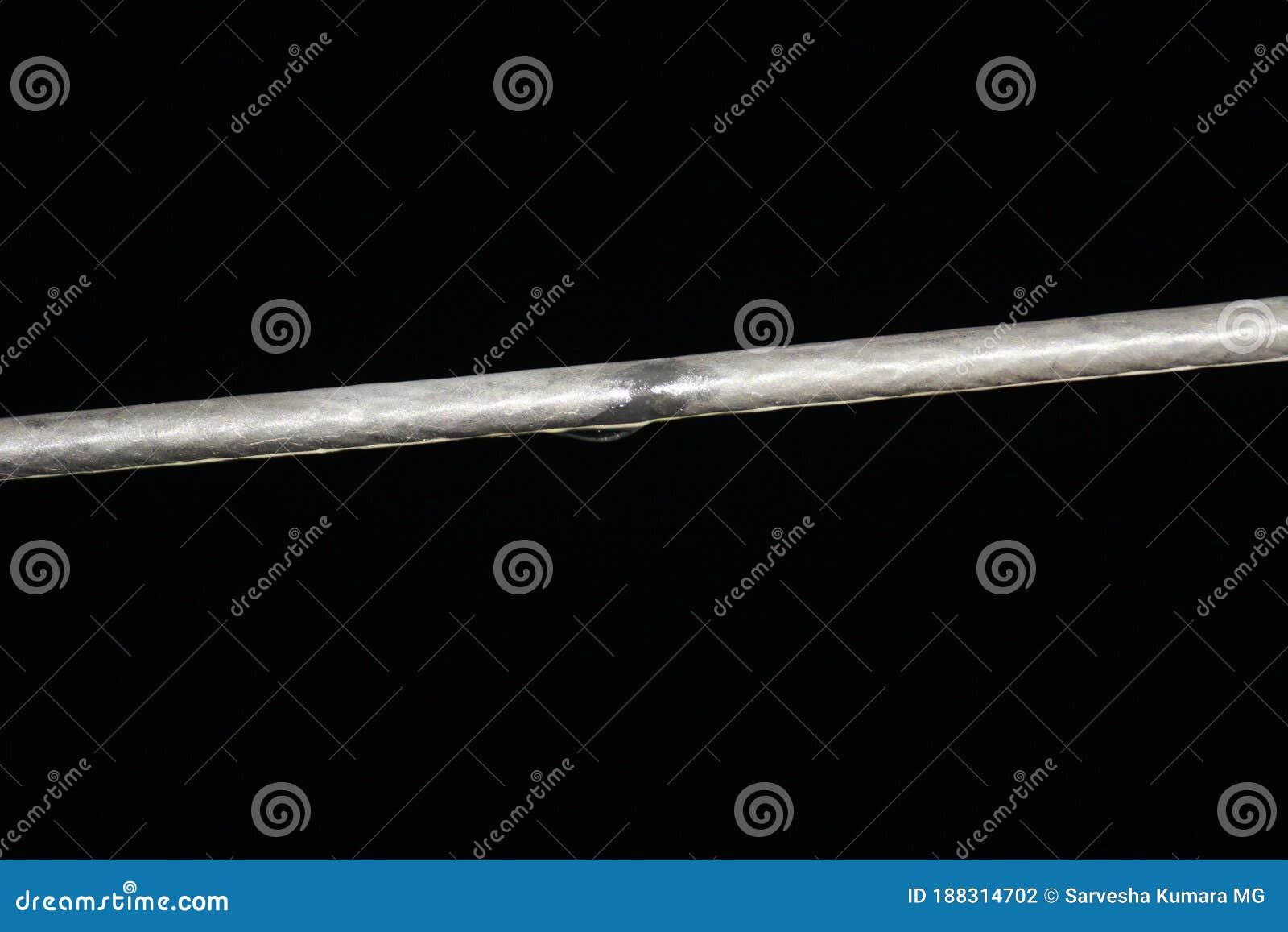 An Electric Cable in the Dark Night. a Drop of Rain Water is Falling ...