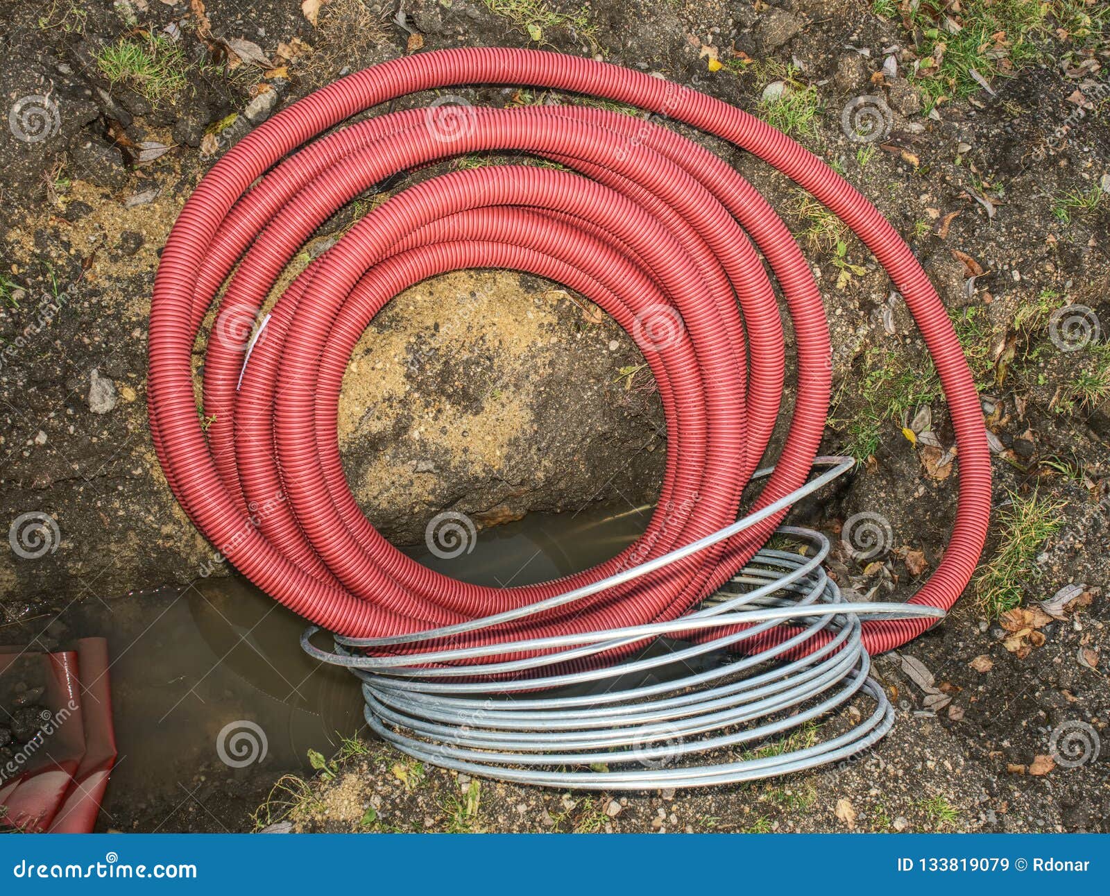 Electric Cable in the Flexible Safety Pipe in Pit Stock Image - Image ...