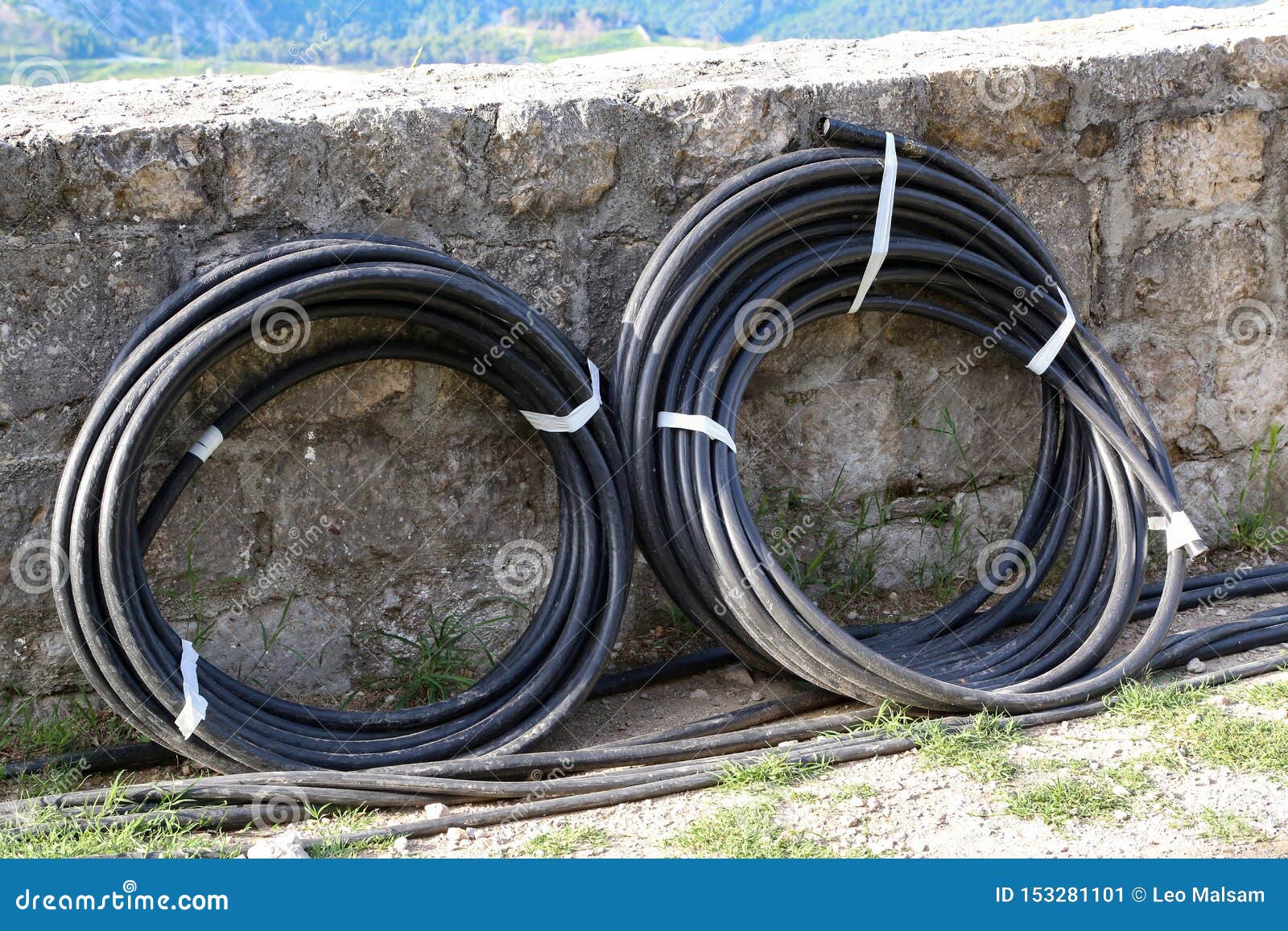 The Electric Cable in the Roll Stands Against the Wall Stock Image ...