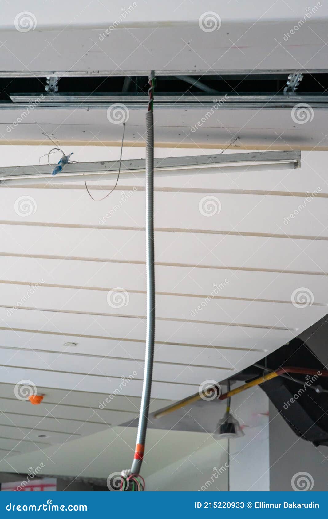 Electric Cables Hanging from Ceiling in a Construction Site. Work in ...