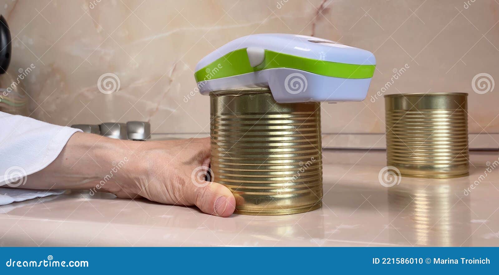 Electric Can Opener and Canned Goods on Table Stock Photo - Image of ...