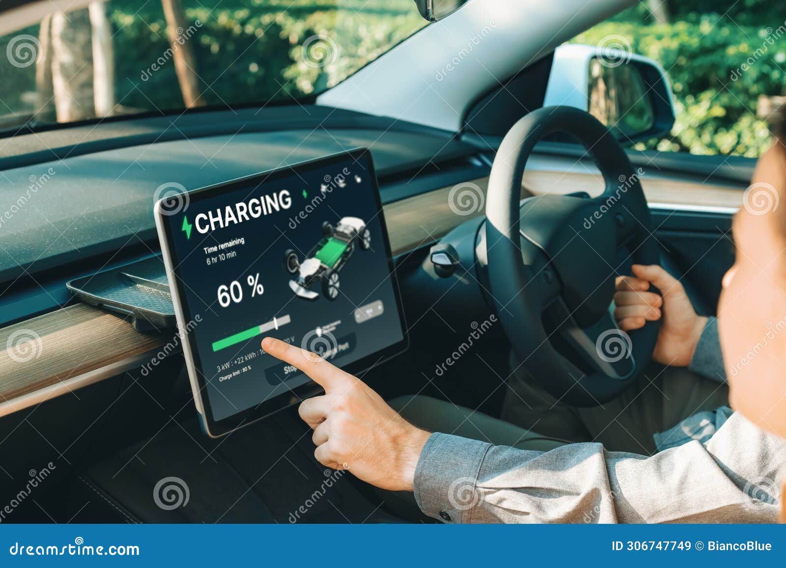 Electric Car Driver Checks Battery Charging Status App Screen in Car ...