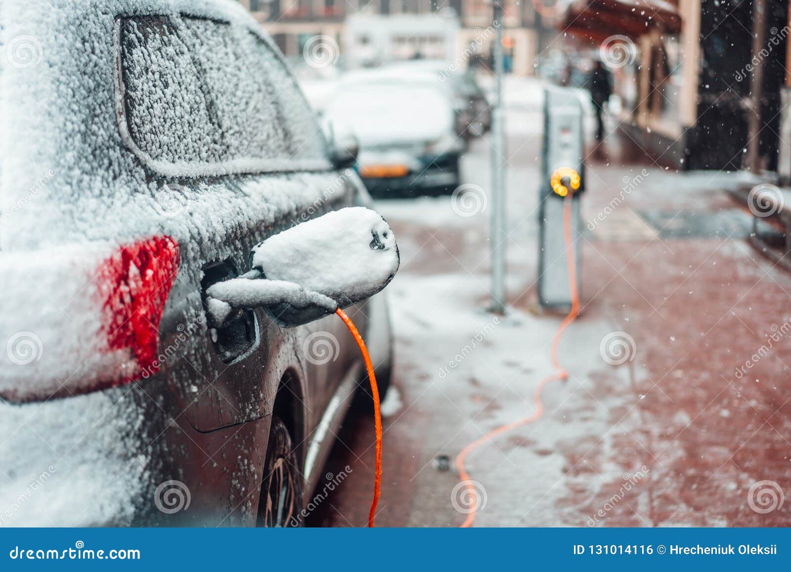 Electric Car Plug Charging in the Winter Stock Photo - Image of ...