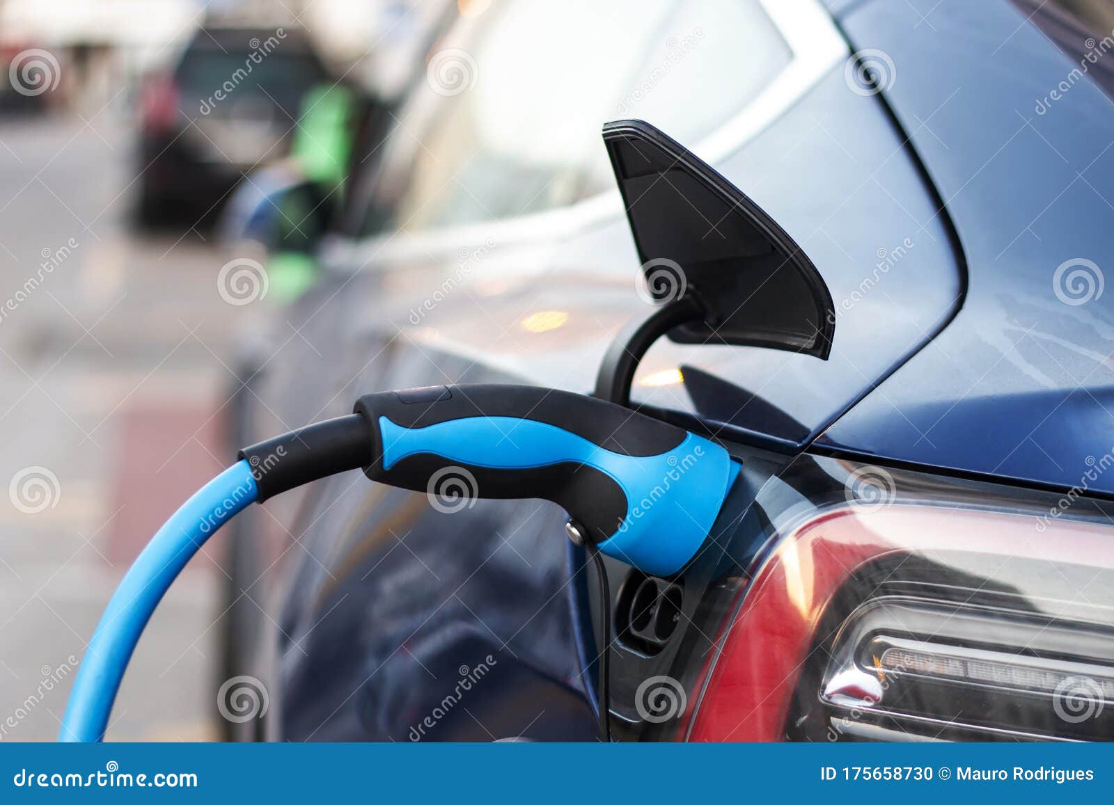 Electric Car Plugged in for Charging Stock Photo - Image of automobile ...