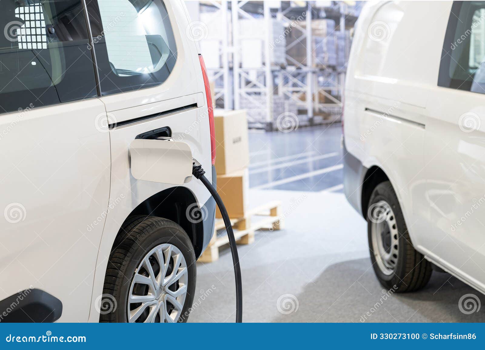 Electric Delivery Van with Connected Charging Cable Stock Photo - Image ...