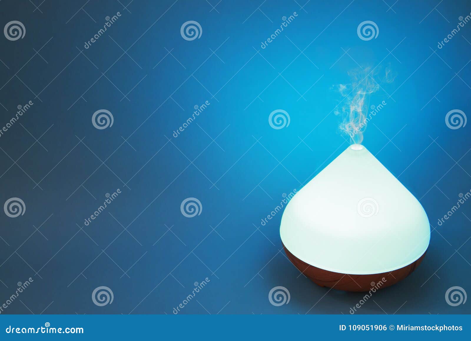 Electric Essential Oil Diffuser Isolated On Blue Background Royalty ...