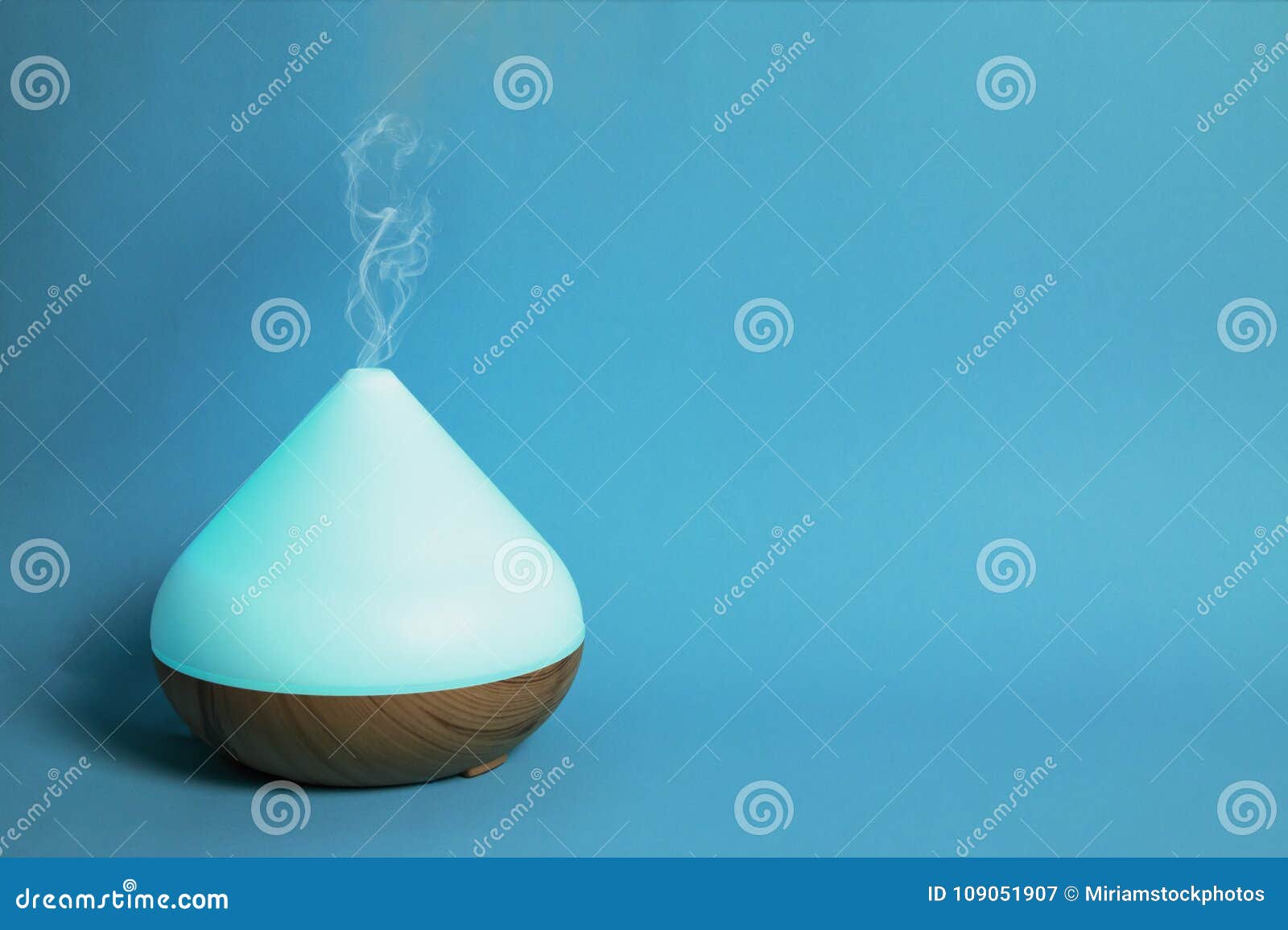 Electric Essential Oil Diffuser Isolated on Blue Background Stock Image ...