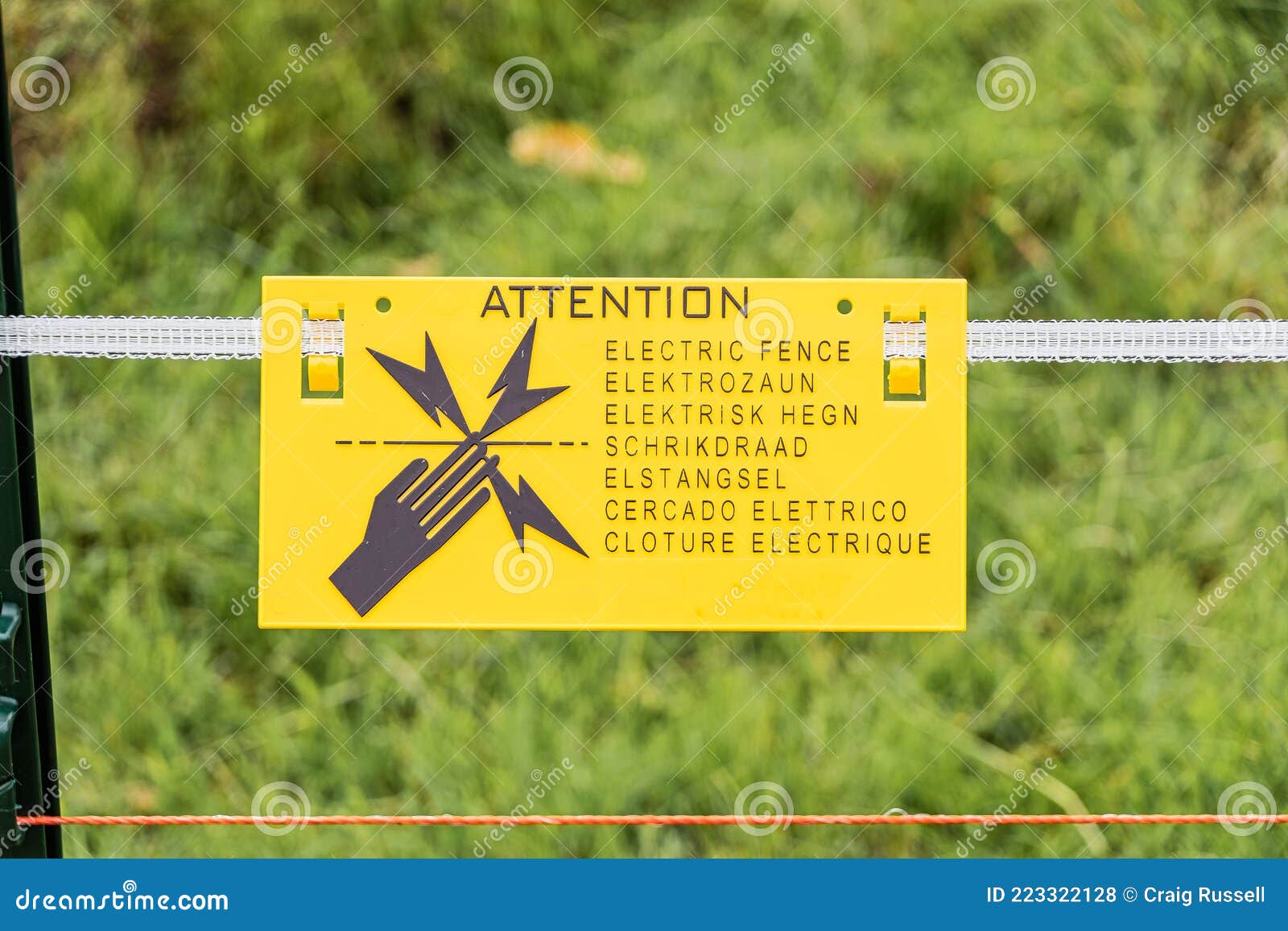 Electric Fence Warning Sign in Multiple Languages Stock Photo - Image ...