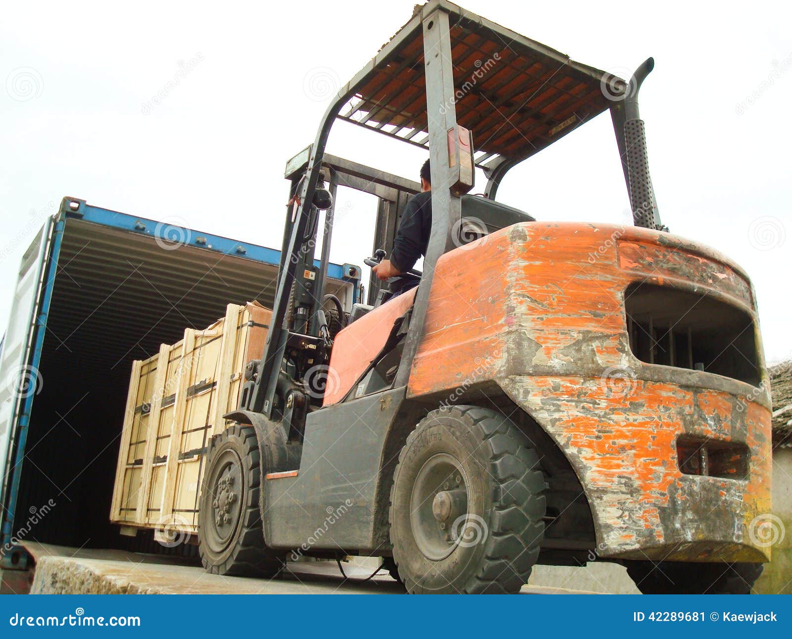 Electric Forklift Loading Cargos into Container Stock Image - Image of ...