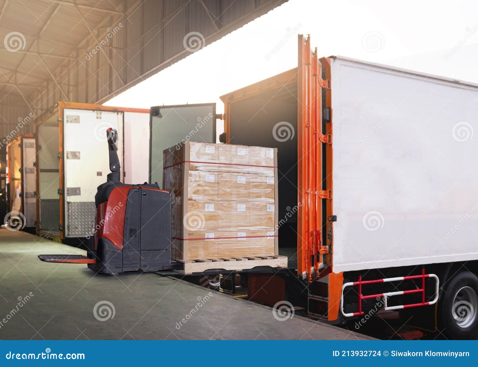 Electric Forklift Loading Shipment Boxes into Cargo Container. Cargo ...