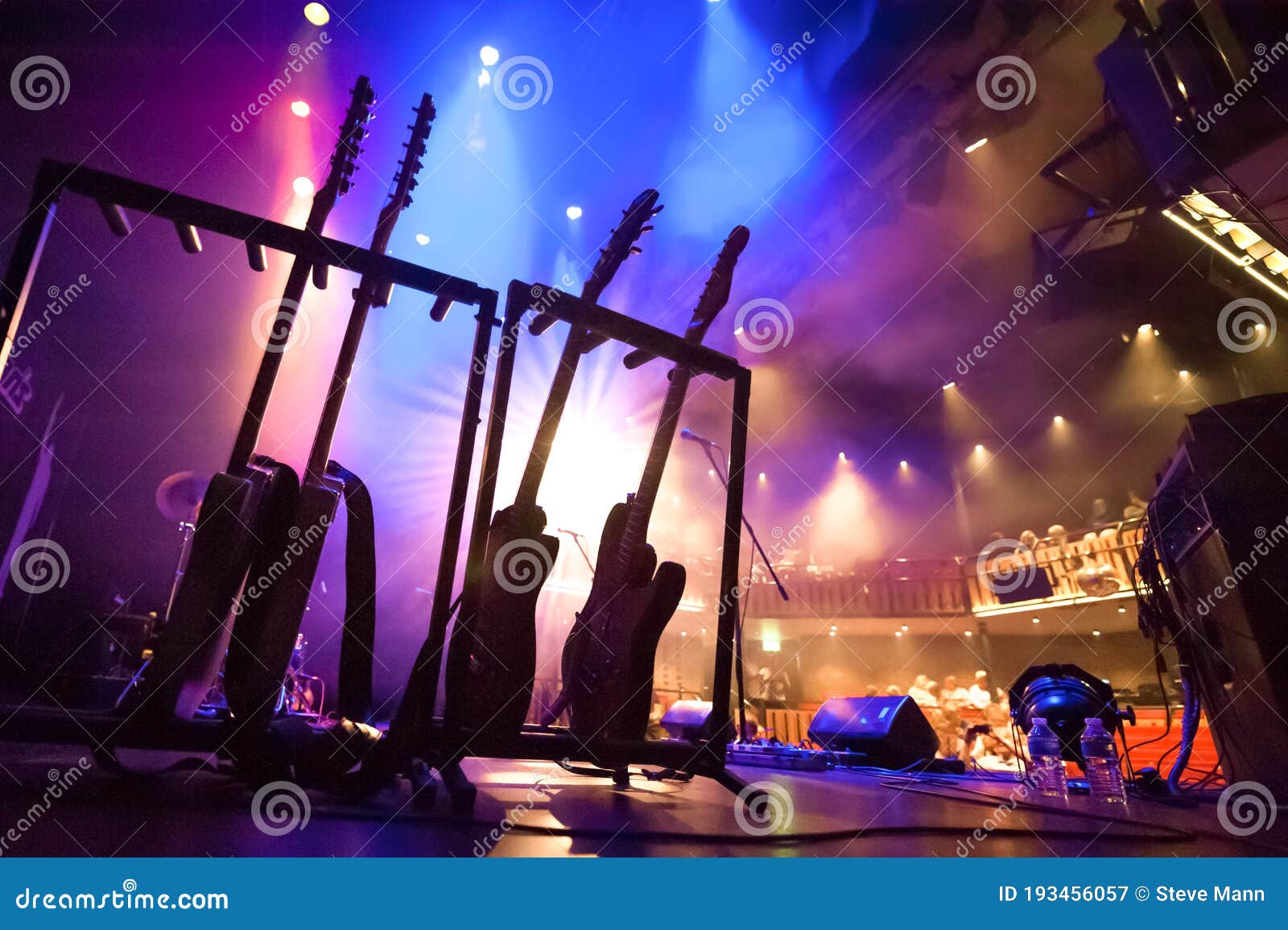 Electric guitars on stage editorial photography. Image of spotlights ...