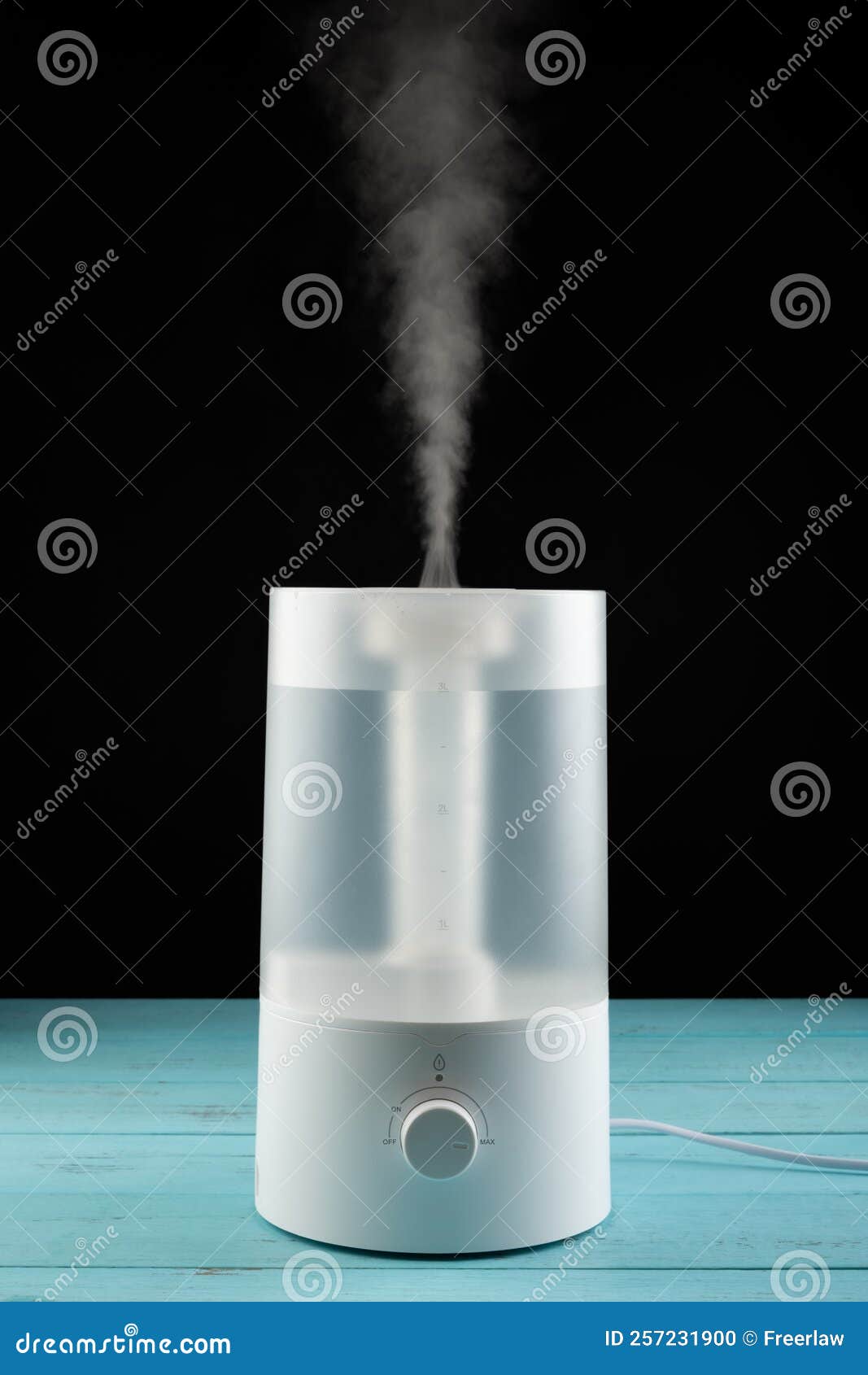 An Electric Humidifier on a Table Vertical Composition Stock Photo ...