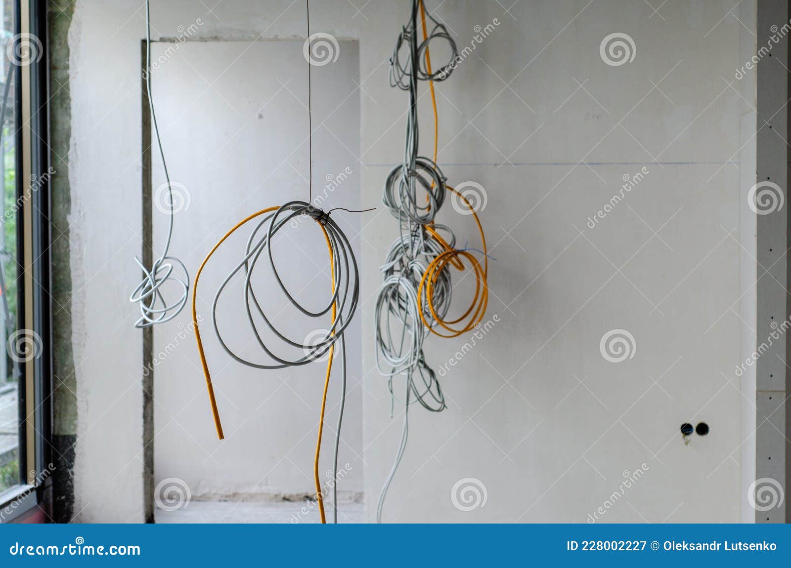 Electric Installation Work. Pulling Wires in an Unfinished House Stock ...