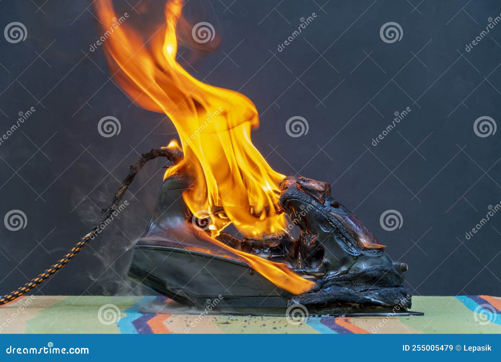 The Electric Iron on the Table Caught Fire from Overheating, a Fire ...