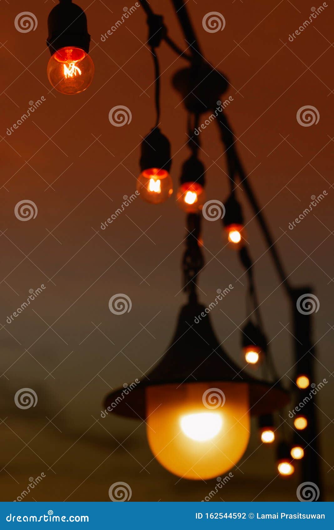 Electric Light Bulb Hanging on Wire Stock Photo - Image of electric ...
