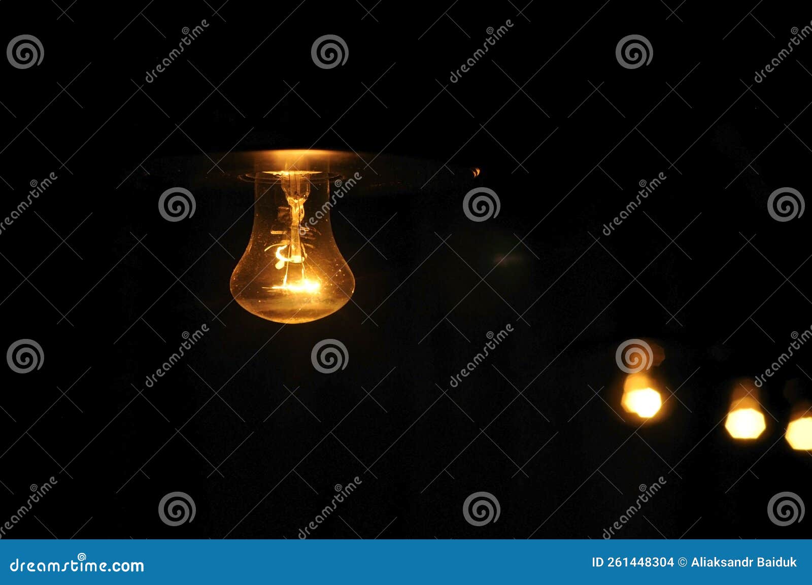 Electric Light Bulb Shines Dimly in the Dark Stock Photo - Image of ...