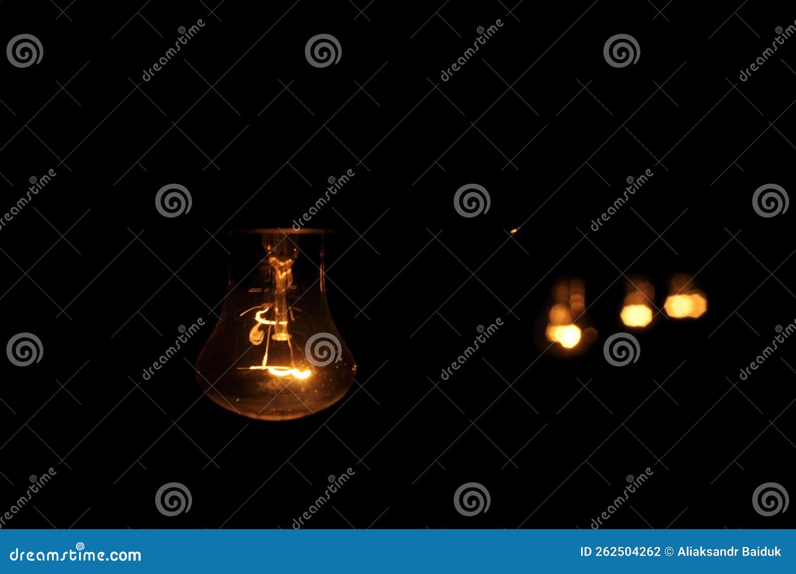Electric Light Bulb Shines Dimly in the Dark Stock Photo - Image of ...