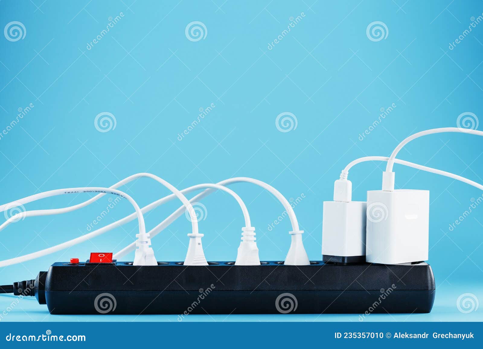 Electric Mains Filter with Inserted White Plugs of Electrical ...