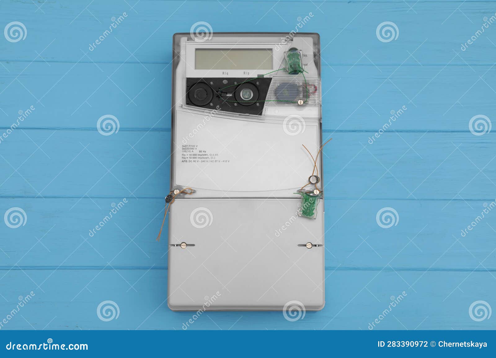 Electric Meter on Light Blue Wooden Background, Top View. Measuring ...