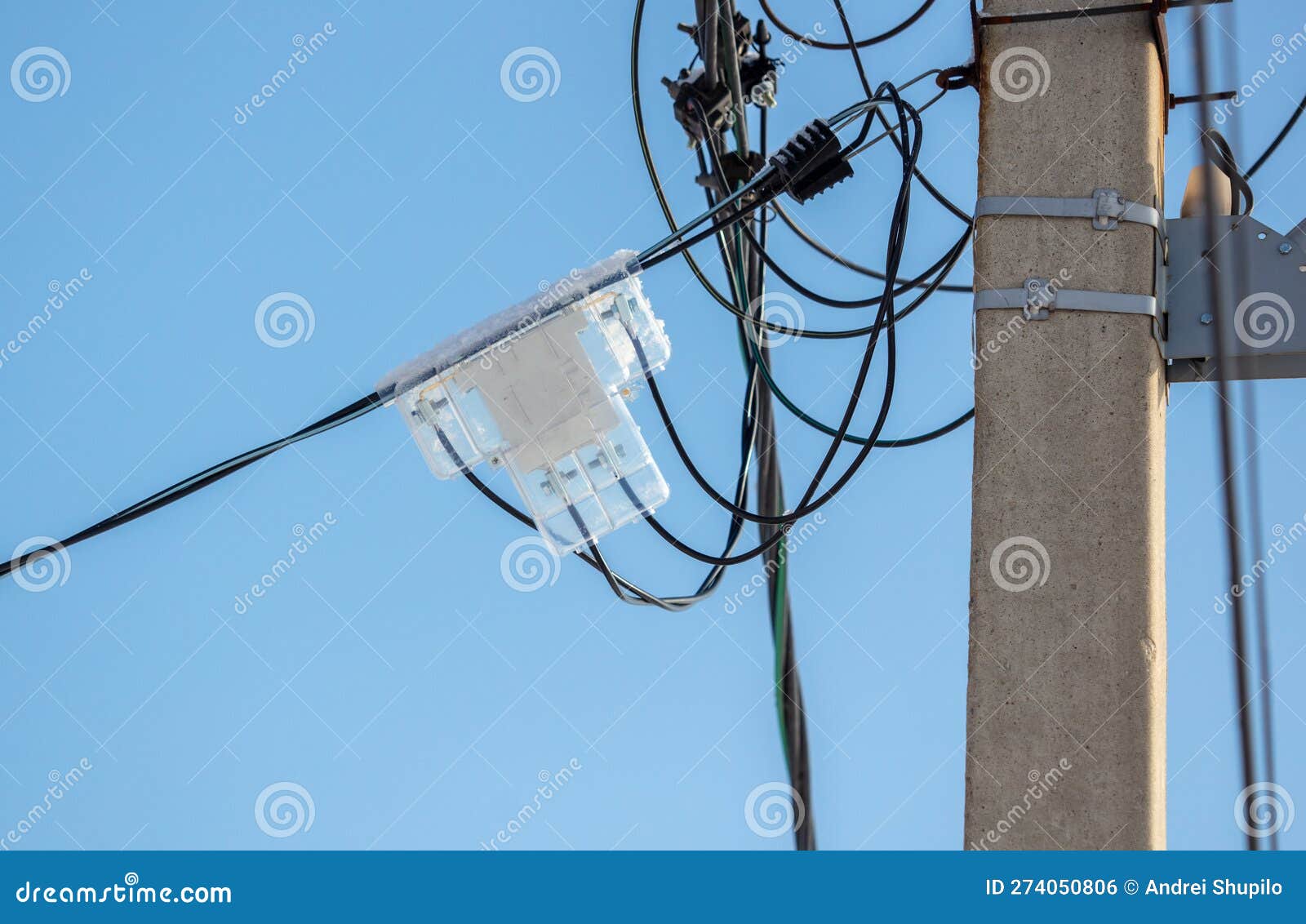 An Electric Meter on a Pole Against a Blue Sky Stock Photo - Image of ...