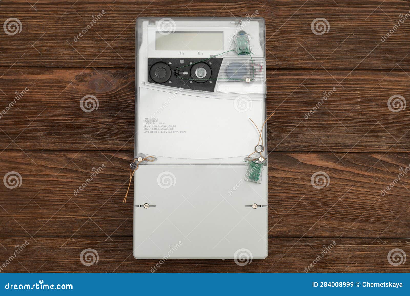 Electric Meter on Wooden Background, Top View. Measuring Device Stock ...