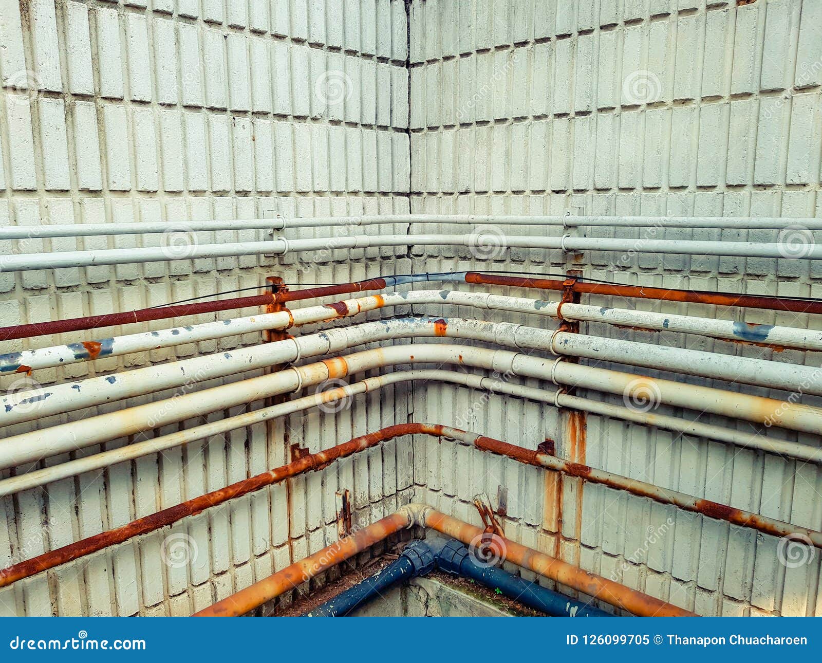 Electric Pipe Rusty on the Stone Wall Background. Stock Image - Image ...