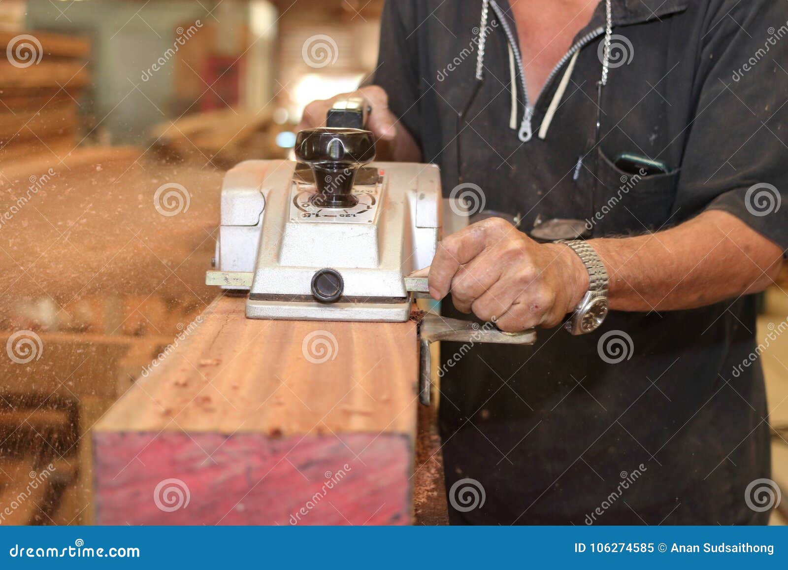 Electric Planer is Being Worked with Hands of Senior Carpenter in ...