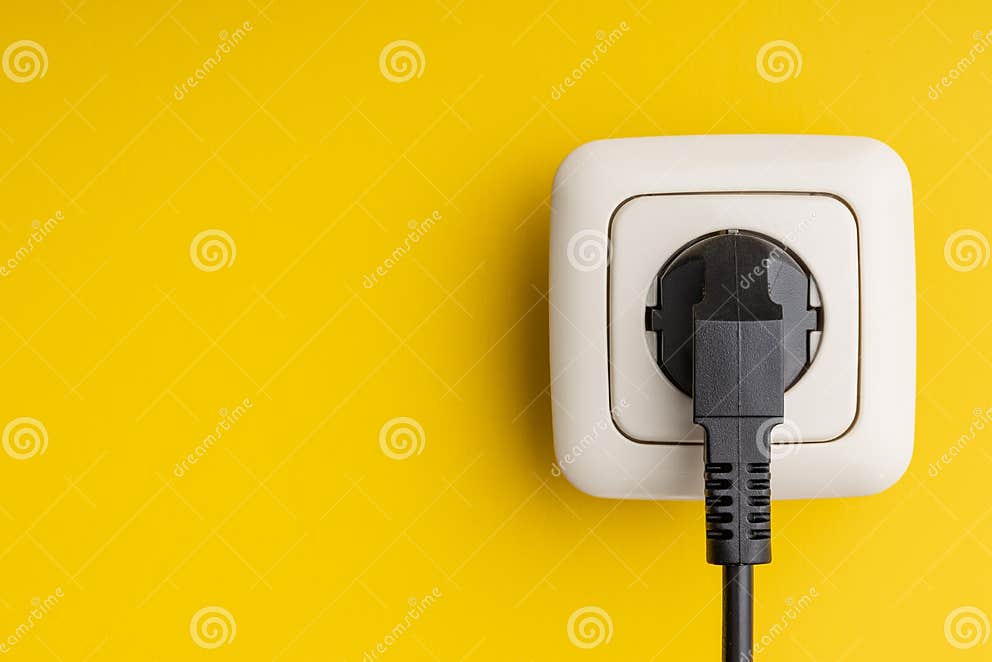 Electric Plug and Wall Socket on Yellow Wall Stock Image - Image of ...
