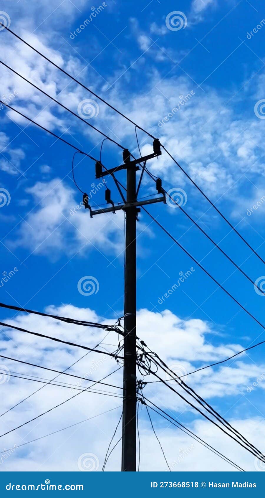 Electric Pole in Front of the House with Bright Clouds As a Background ...