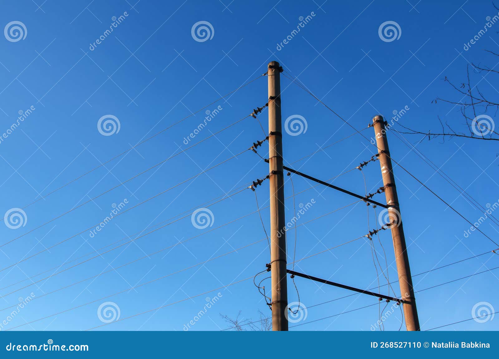 Electric Pole with a Linear Wire Against the Blue Sky Close-up. Power ...