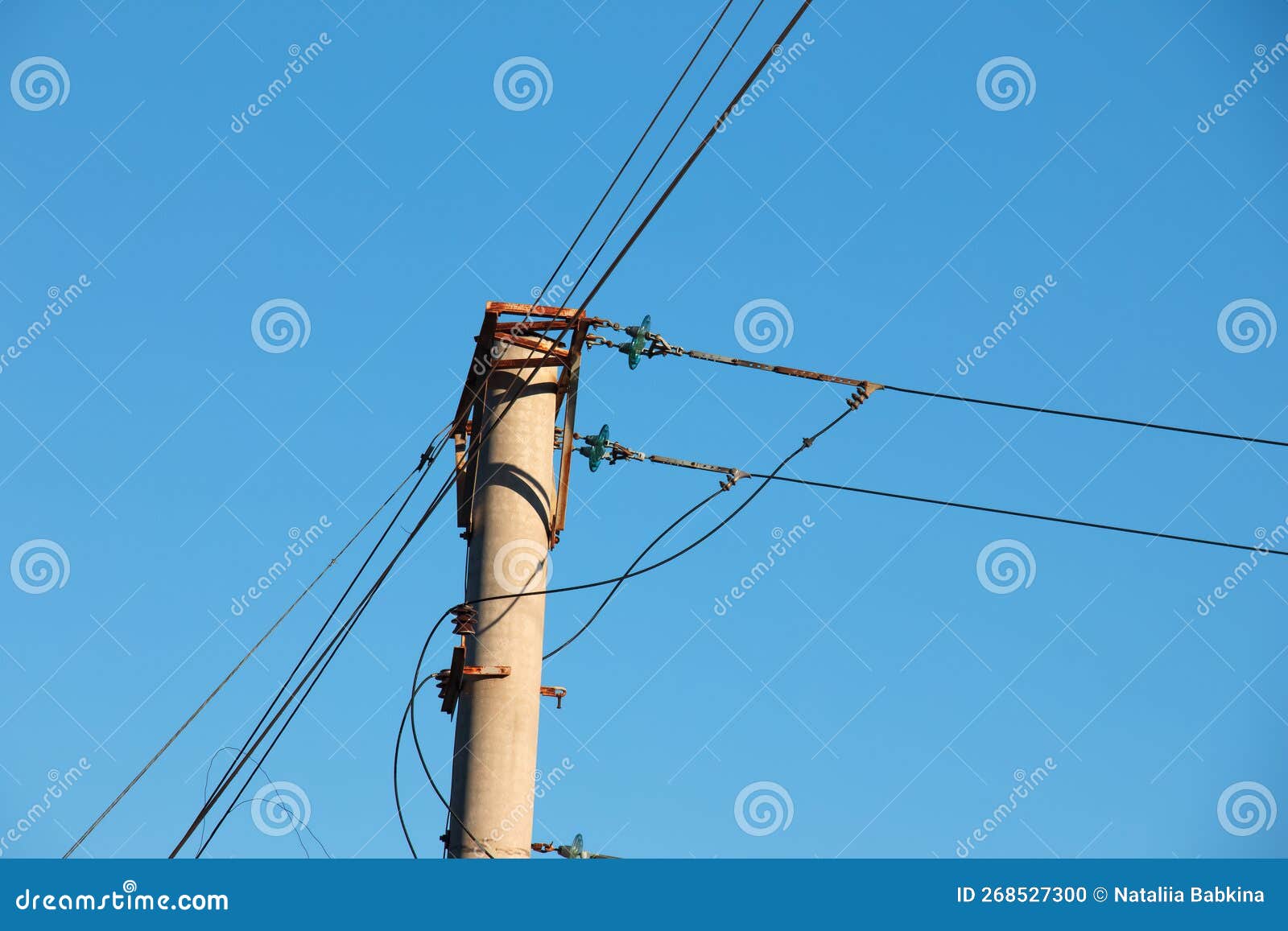 Electric Pole with a Linear Wire Against the Blue Sky Close-up. Power ...