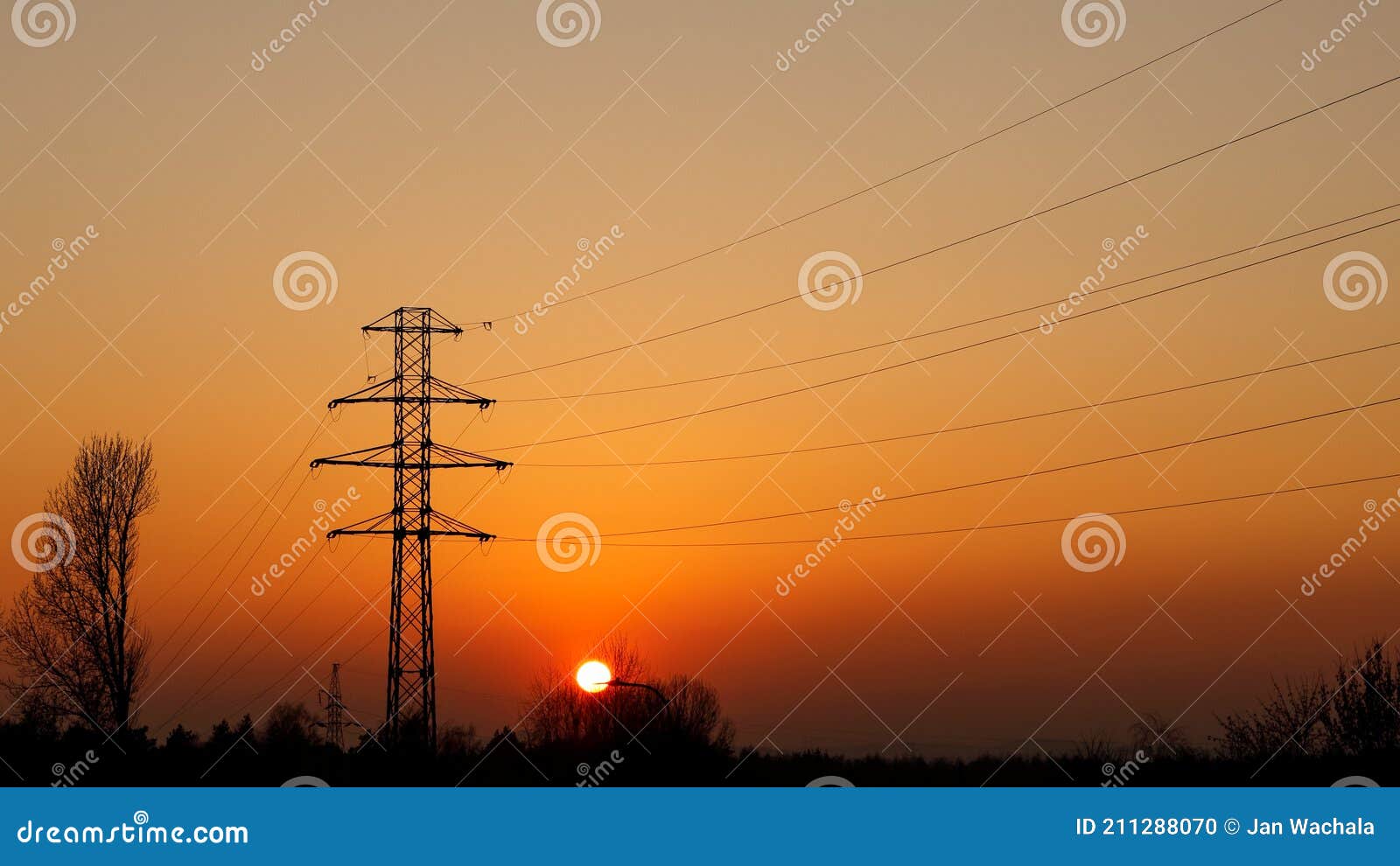 Electric pole at sunset stock photo. Image of industry - 211288070