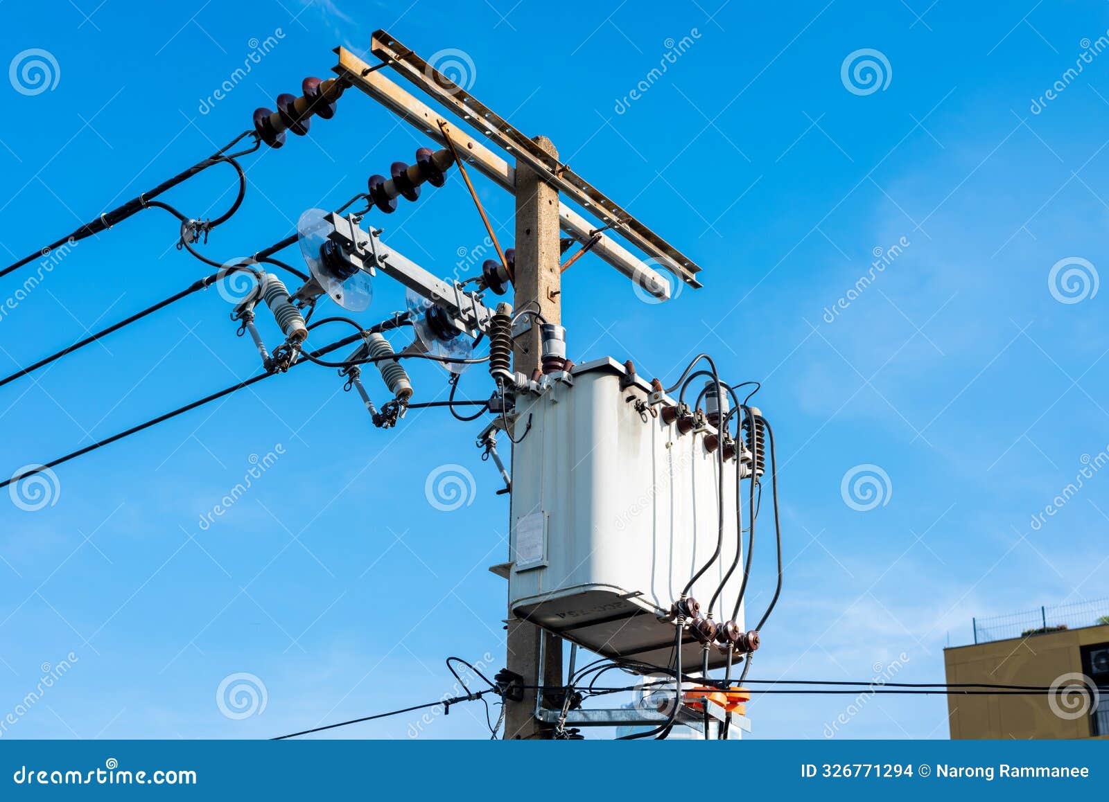 An Electric Pole with Transformer High Voltage on Blue Sky Background ...