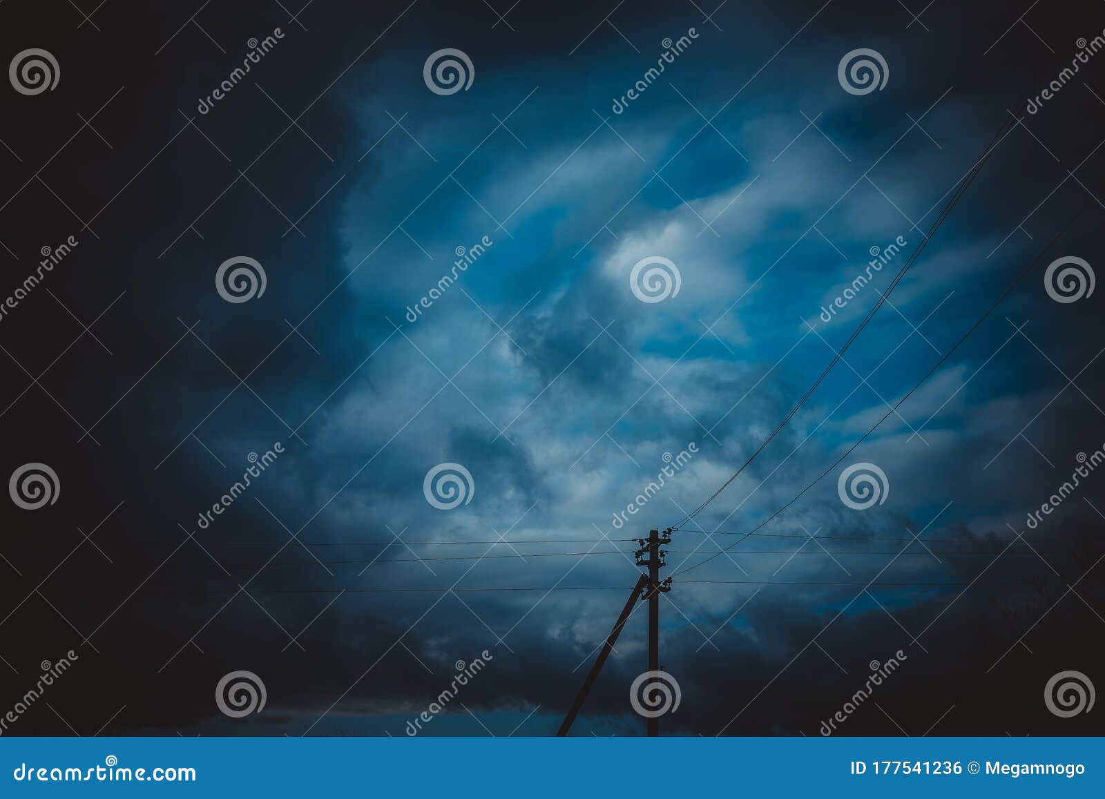 Electric Pole, the Wires are in the Form of a Triangle, Dark Cloudy Sky ...
