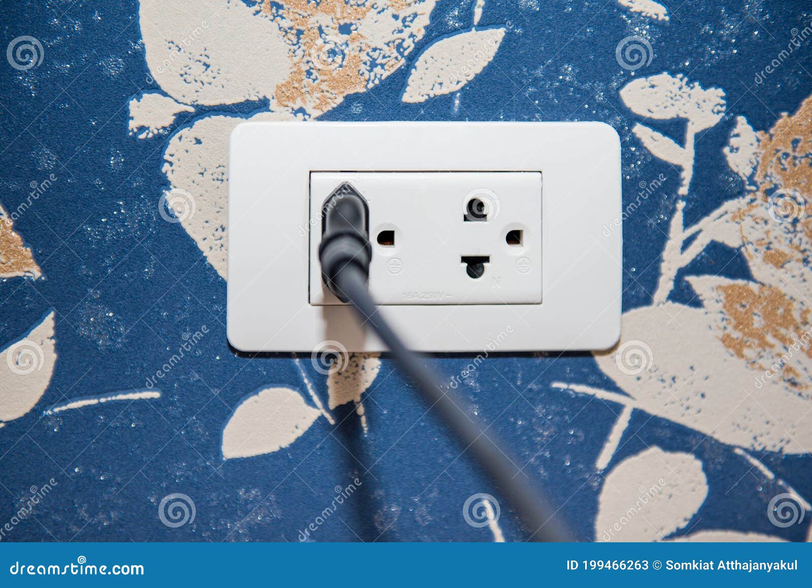Electric Power Plug in a Hand and Inserting into Power Wall Socket ...