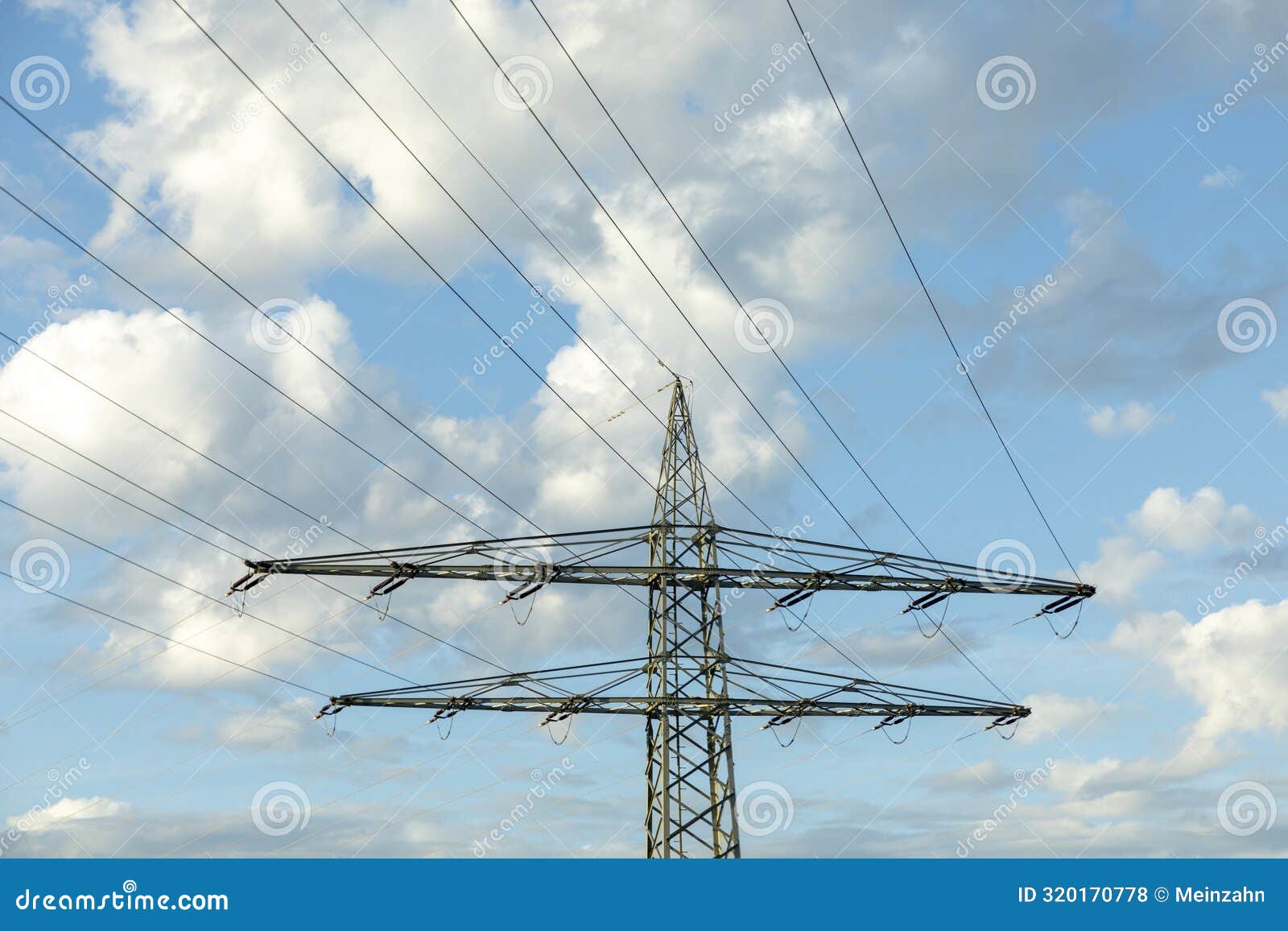 Electric Pylon at Corn Field with Cloudy Sky in Scenic Afternoon Light ...