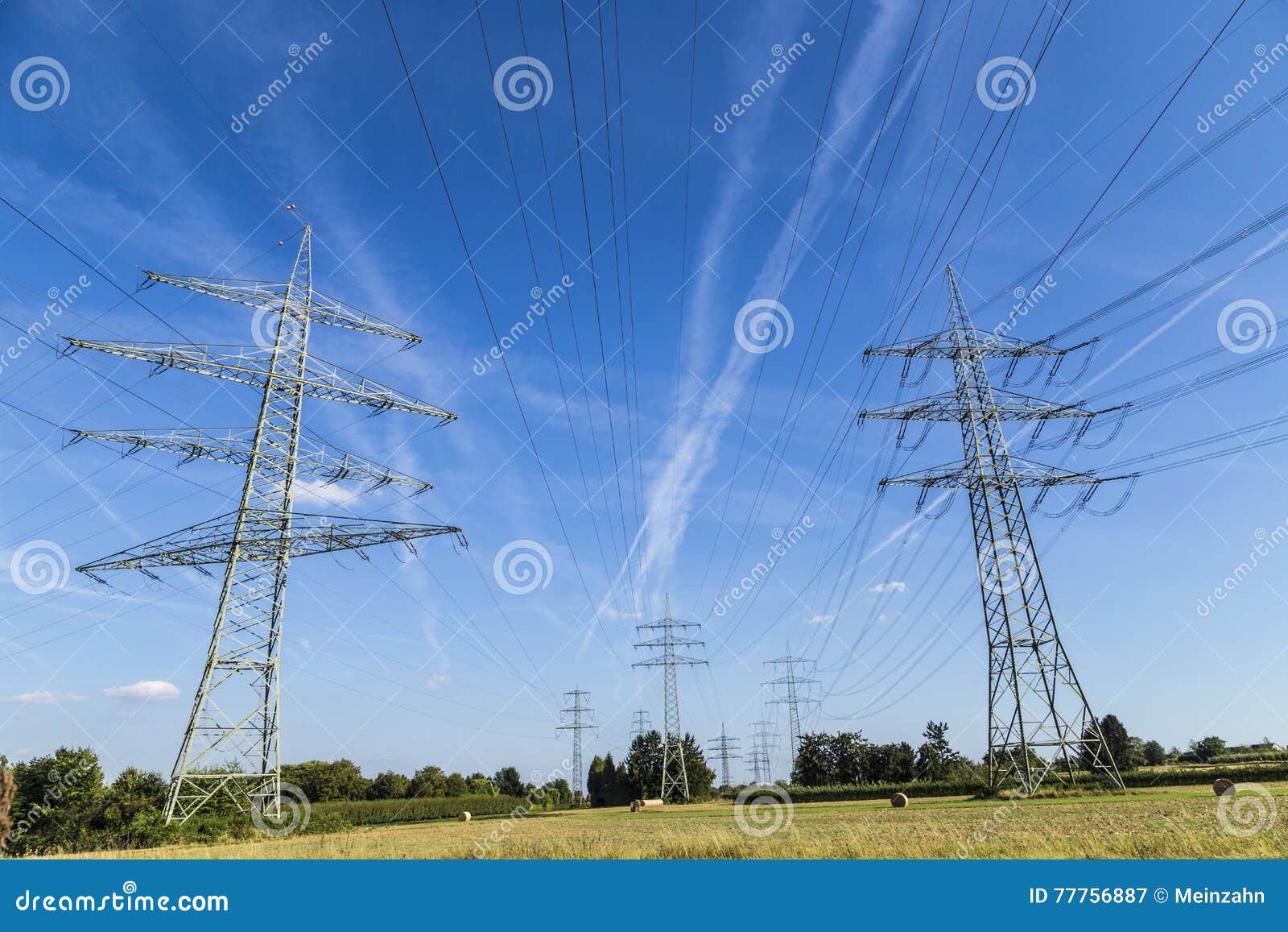 Electric Pylons Transporting Electricity through High Tension Ca Stock ...