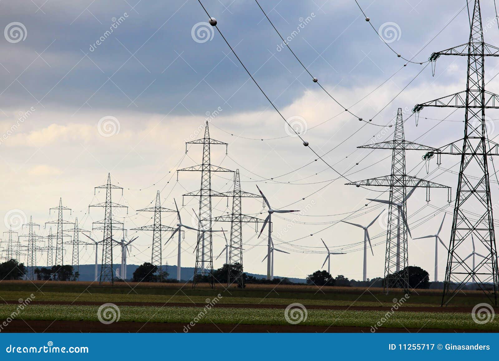 Electric Pylons and Wind Farm Stock Image - Image of pylons, overhead ...