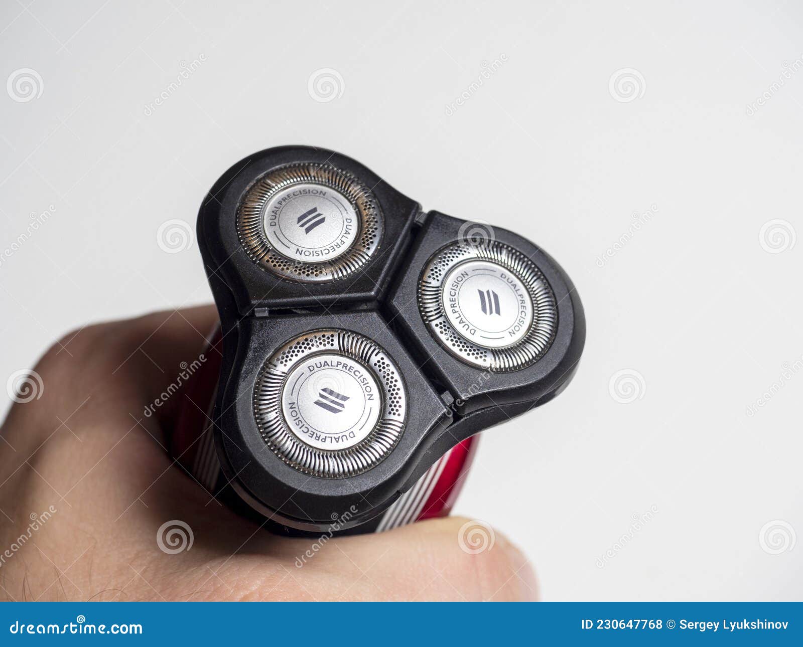 Electric Razor with Three Blades in a Man`s Hand Stock Photo - Image of ...