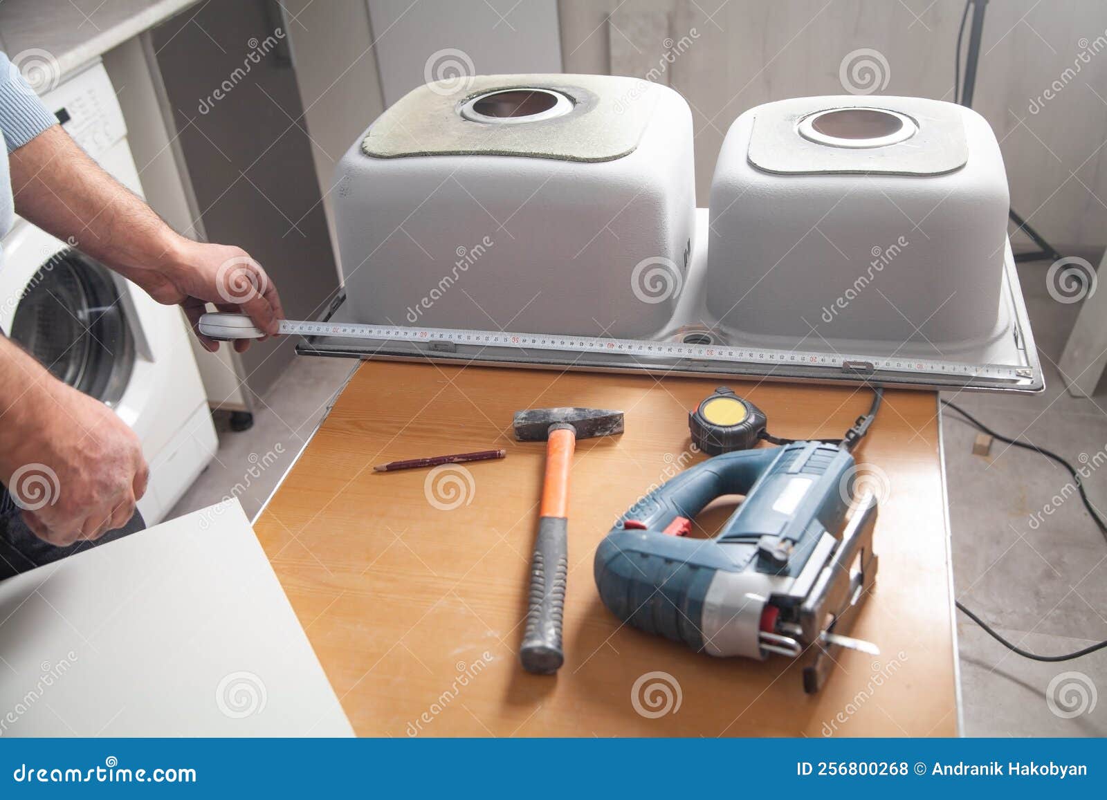 Electric Saw, Hammer on the Table. Man Working in Kitchen Stock Photo ...