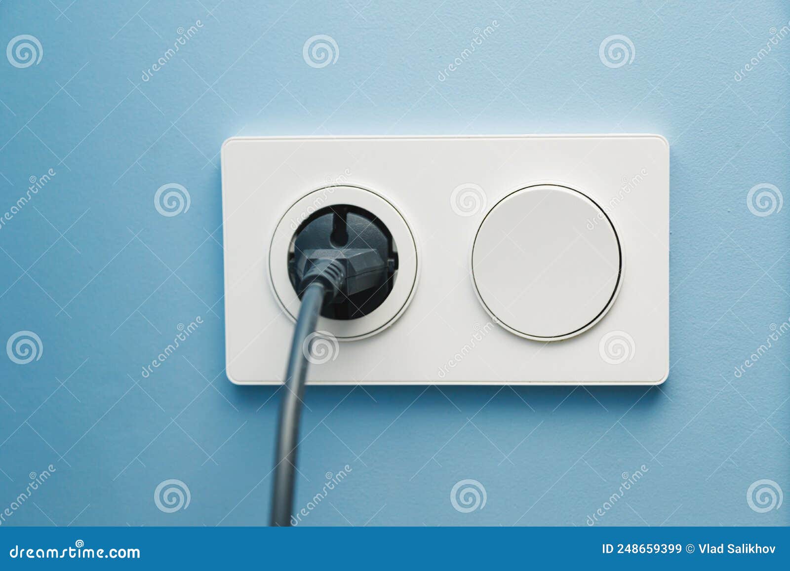 Electric Socket with Plug Cord and a Switch on the Wall Stock Image ...