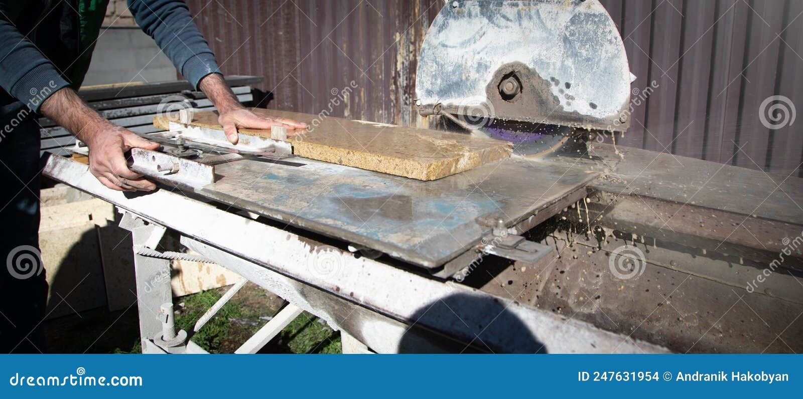 Electric Tile Cutter. Tiler Cutting Tile on Wet Saw Machine Stock Photo ...