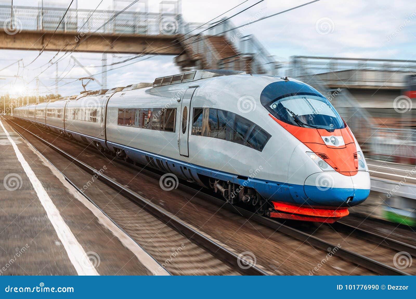 The Electric Train Drives at High Speed at the Station. Stock Photo ...