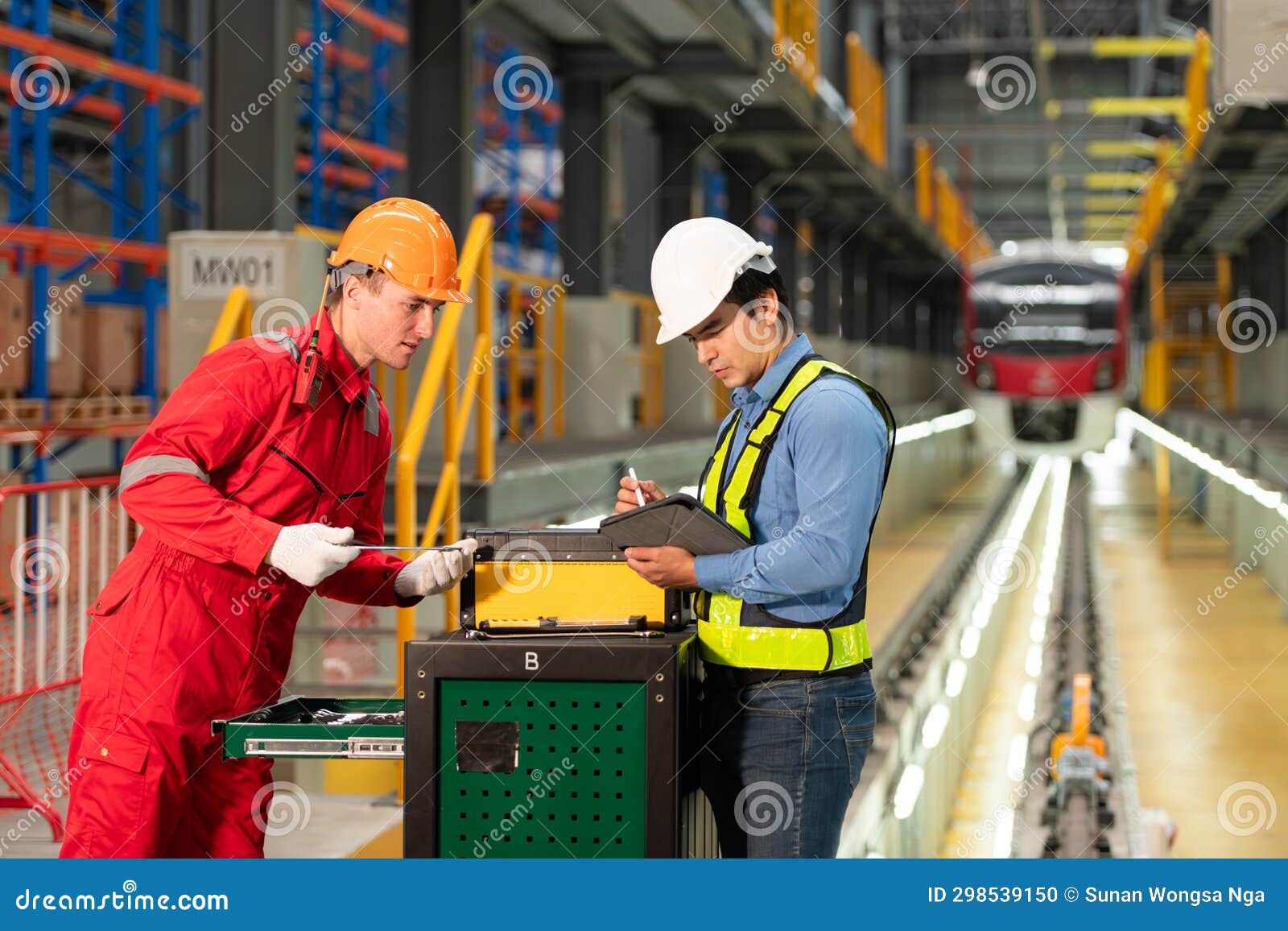 Electric Train Engineer and Technician Using Repair Tools of the ...